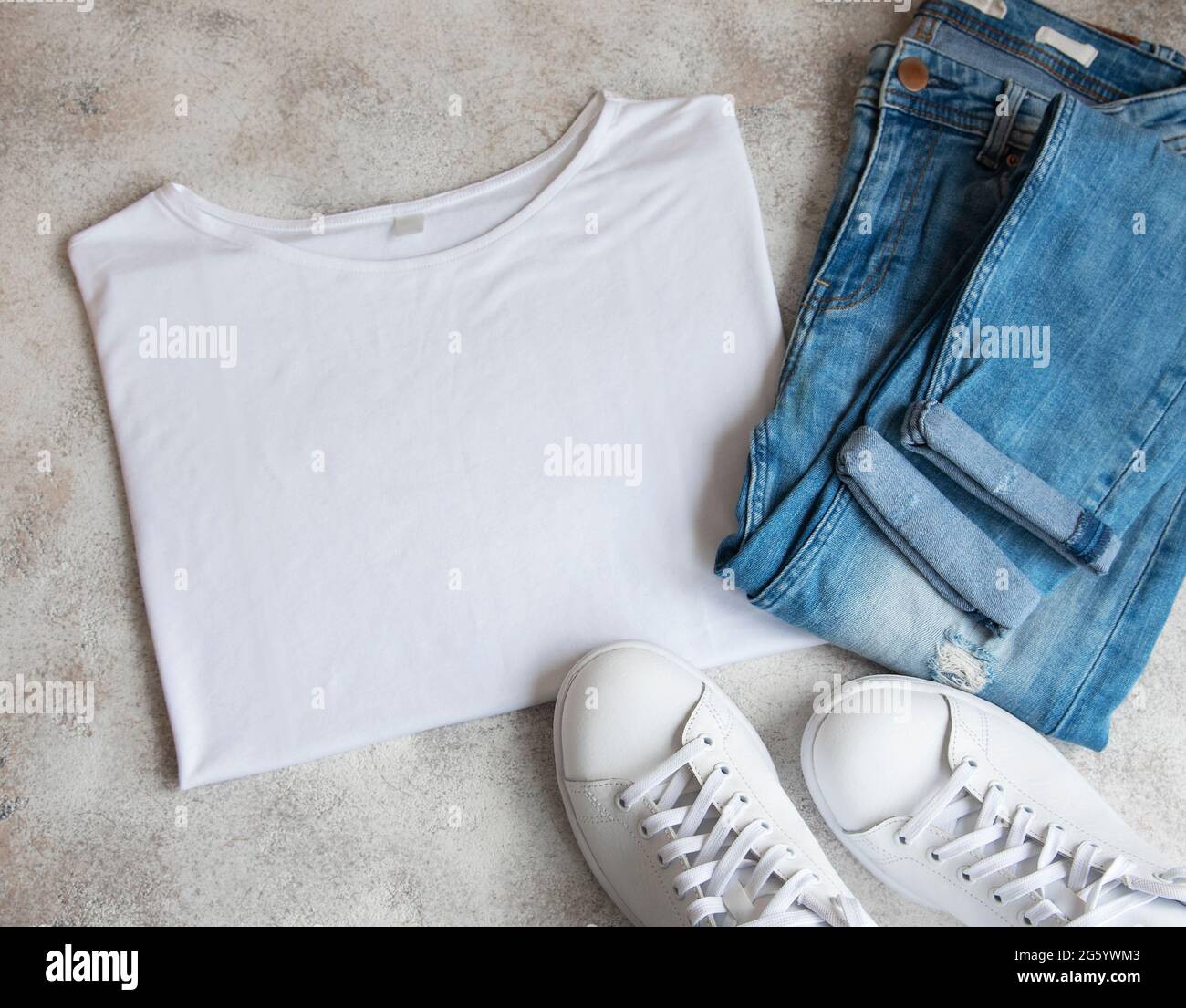Stylish female clothes set. Woman outfit on concrete background. Blue ...