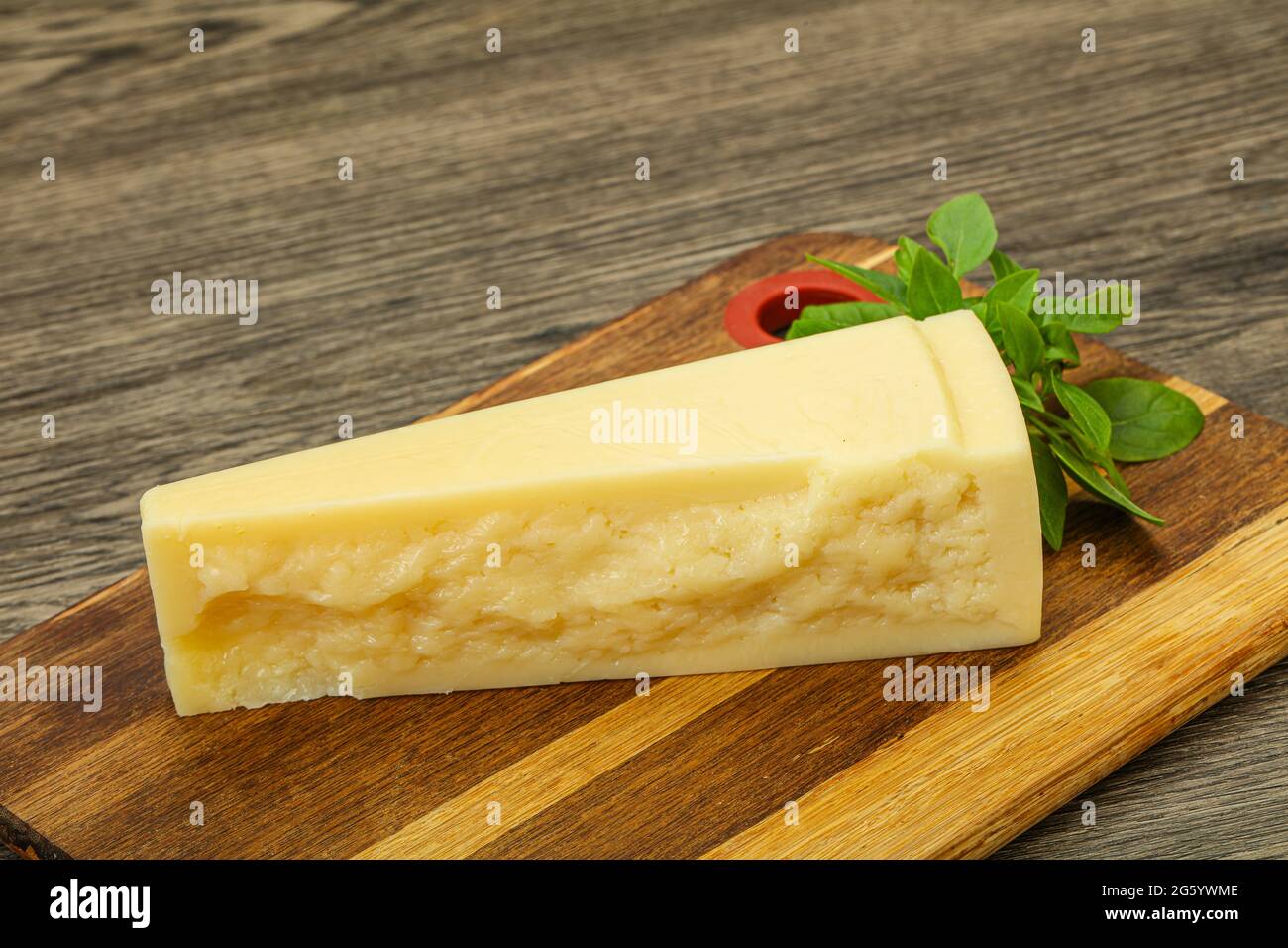 Hard parmesan cheese served basil leaves Stock Photo - Alamy