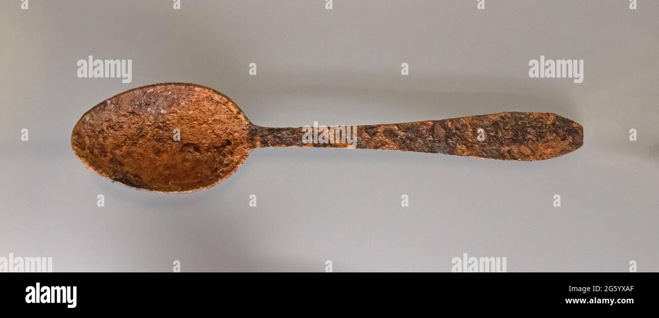Old rusty spoon isolated on a vintage grey background Stock Photo - Alamy