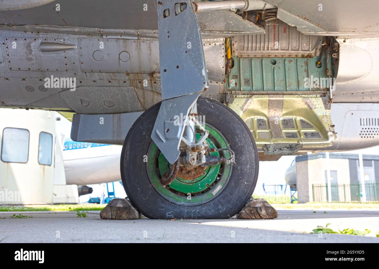 Old black flat wheel of an fighter jet, selective focus Stock Photo - Alamy