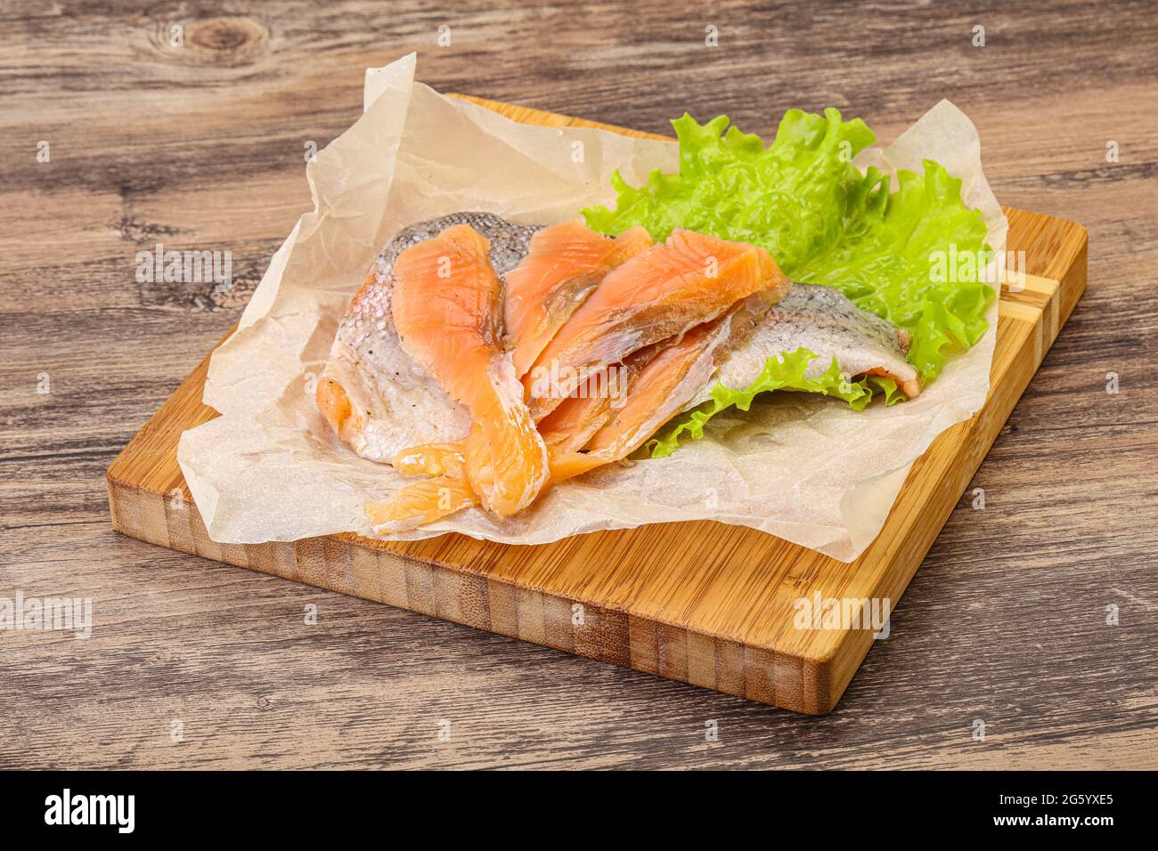 Sliced natural wild trout fillet over board Stock Photo - Alamy