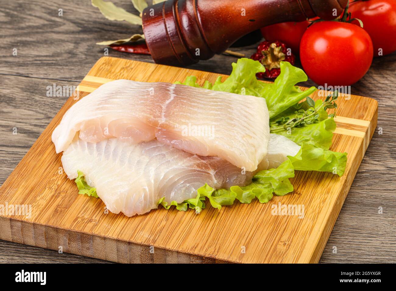 Raw pangasius fillet fish for cooking Stock Photo - Alamy