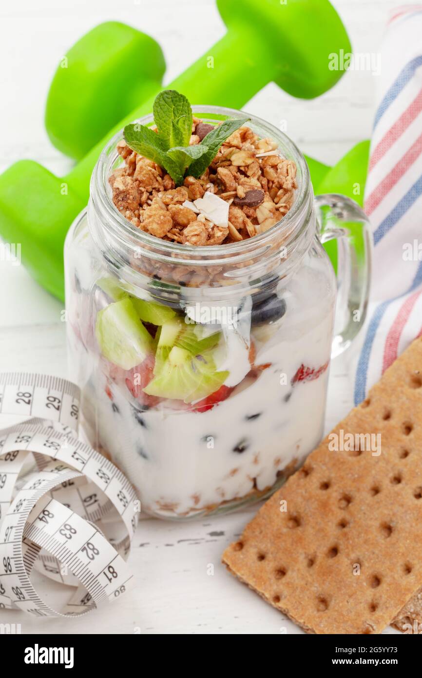 Healthy breakfast with jar of granola, yogurt and fresh berries ...