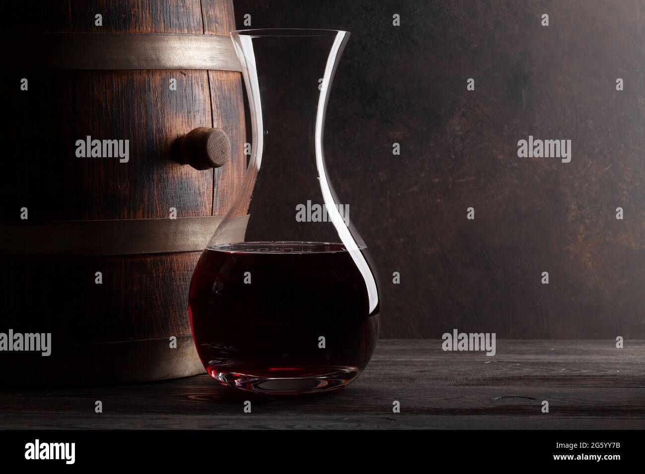 Decanter with red wine and old wooden barrel with copy space Stock ...