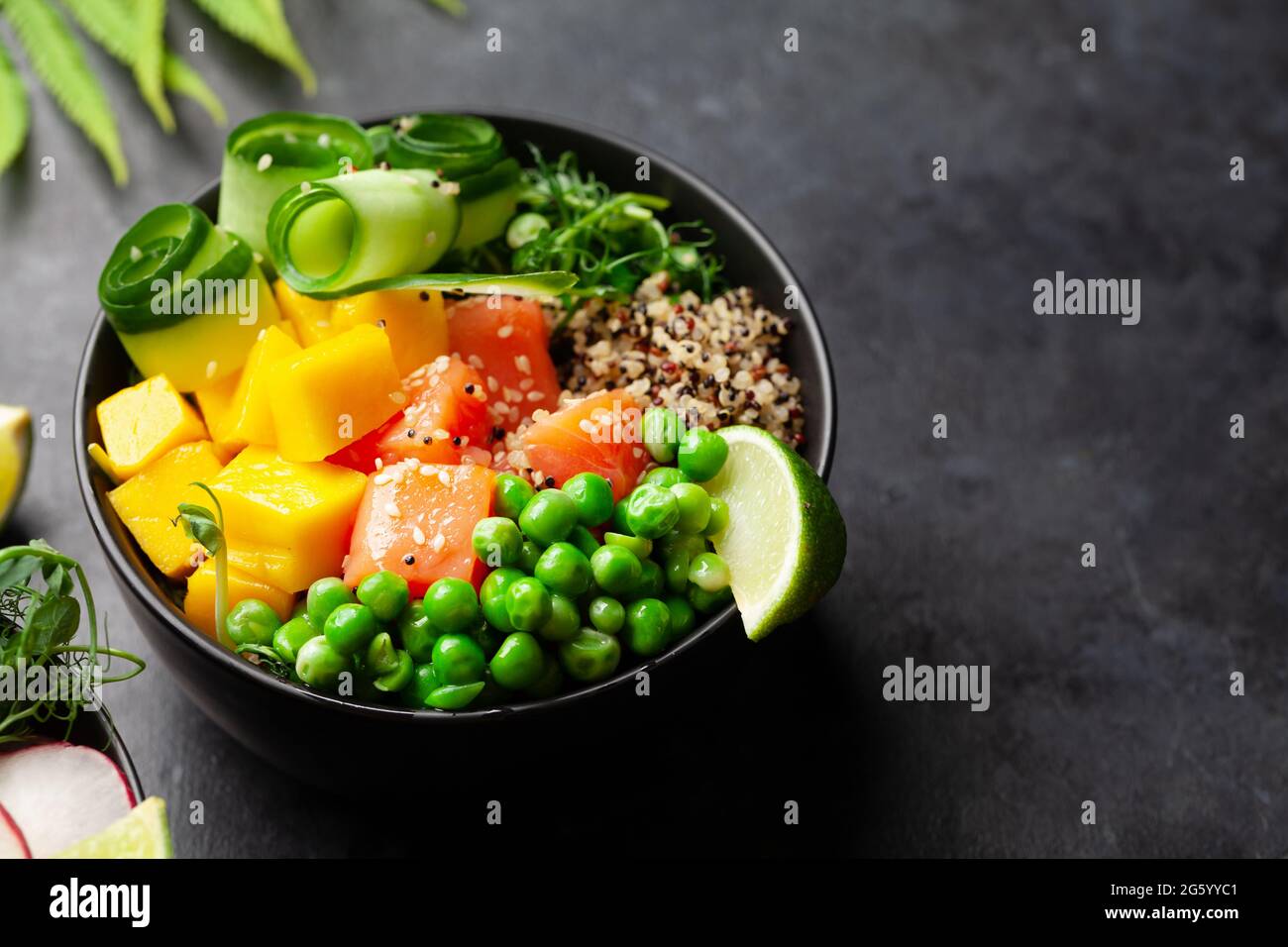 Poke bowl with salmon, cucumber and mango. Traditional hawaiian meal ...
