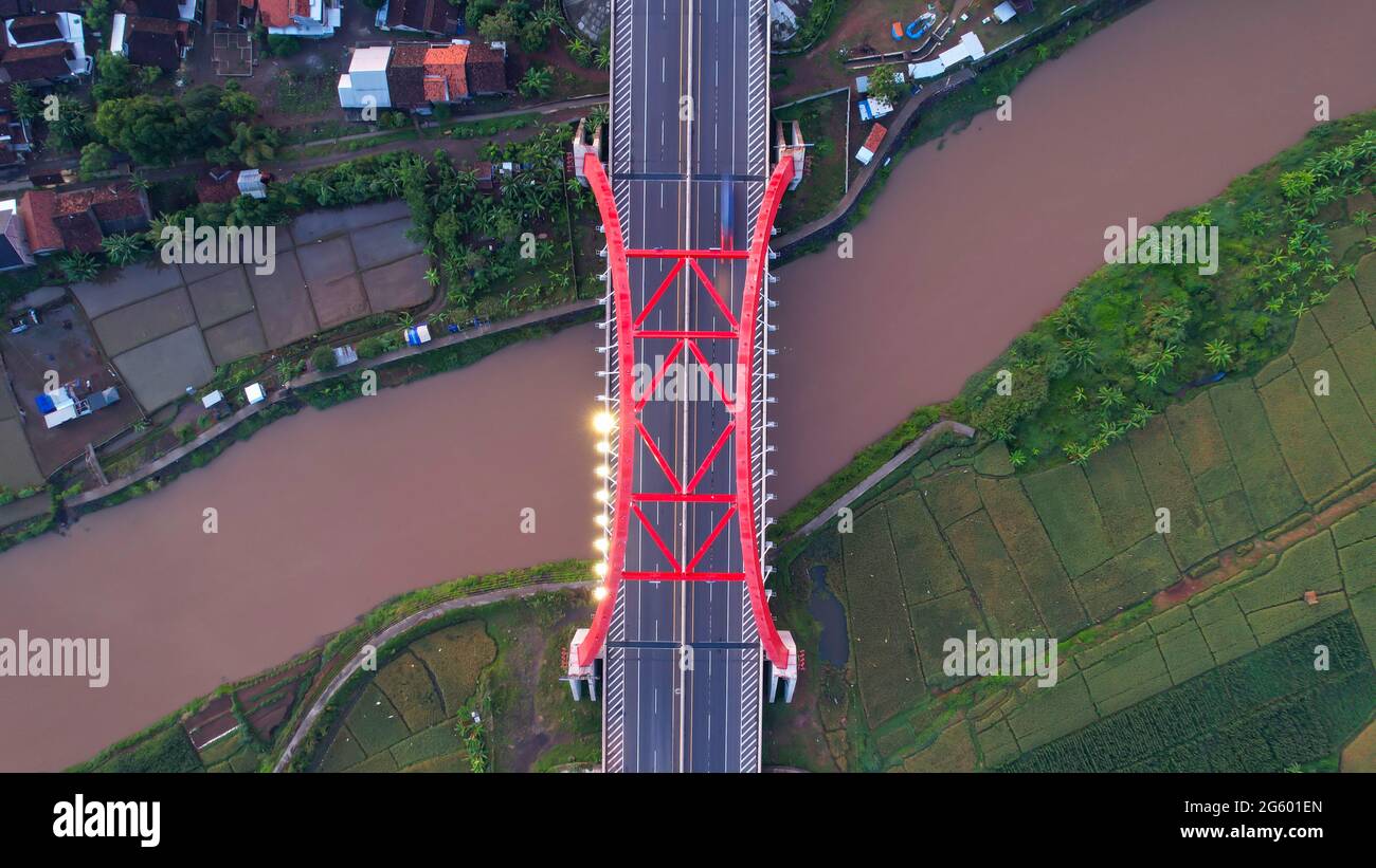 Aerial view of the Kalikuto Bridge, an Iconic Red Bridge at Trans Java ...