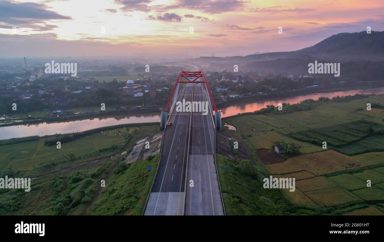 Aerial view of the Kalikuto Bridge, an Iconic Red Bridge at Trans Java ...