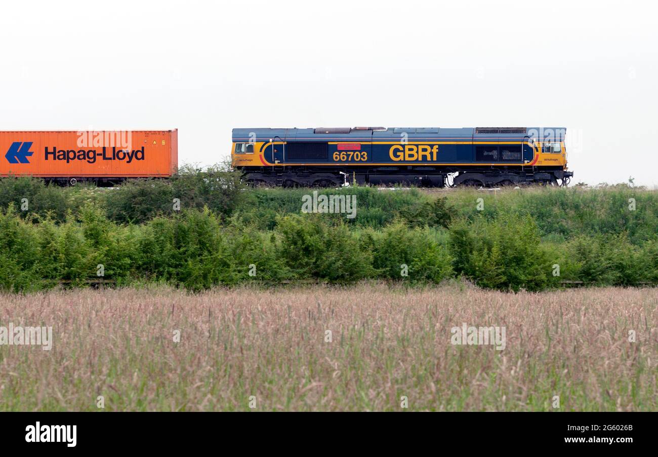 Class 66 diesel locomotive No 66703 "Doncaster PSB" pulling a ...