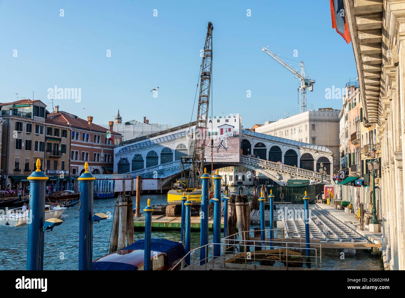 A high crane and floating crane are being used in the restoration work ...