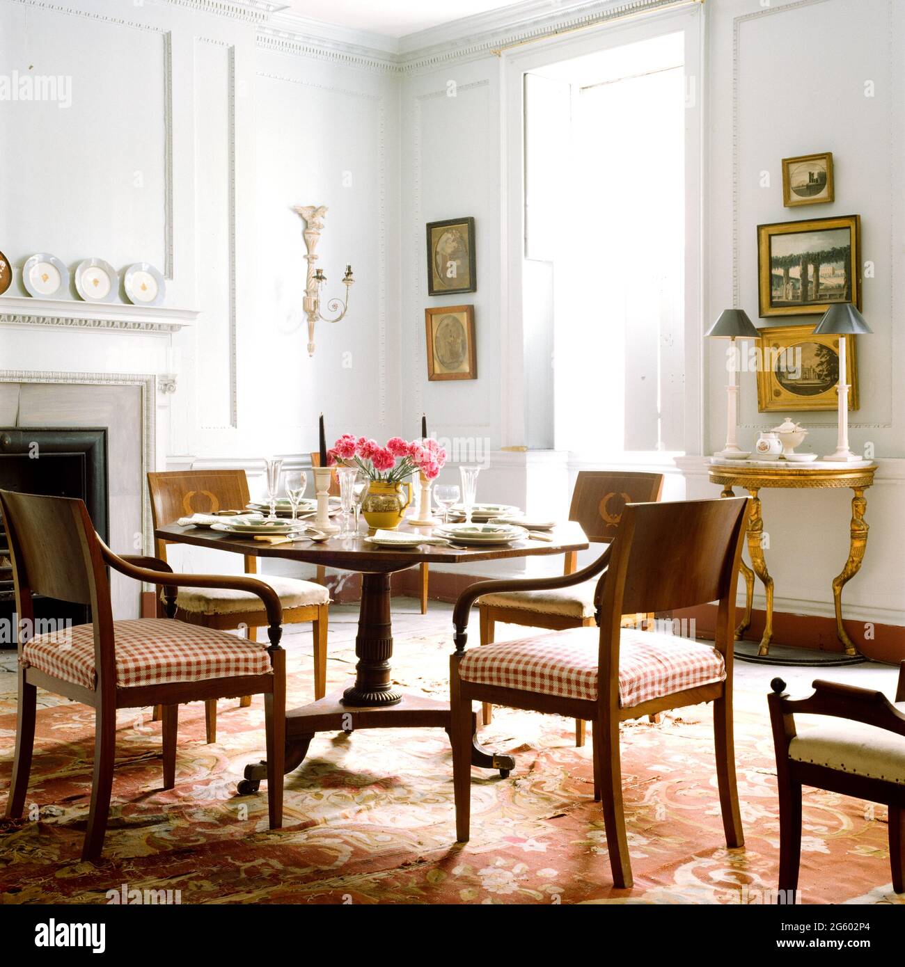 Set dining table in country style dining room Stock Photo - Alamy