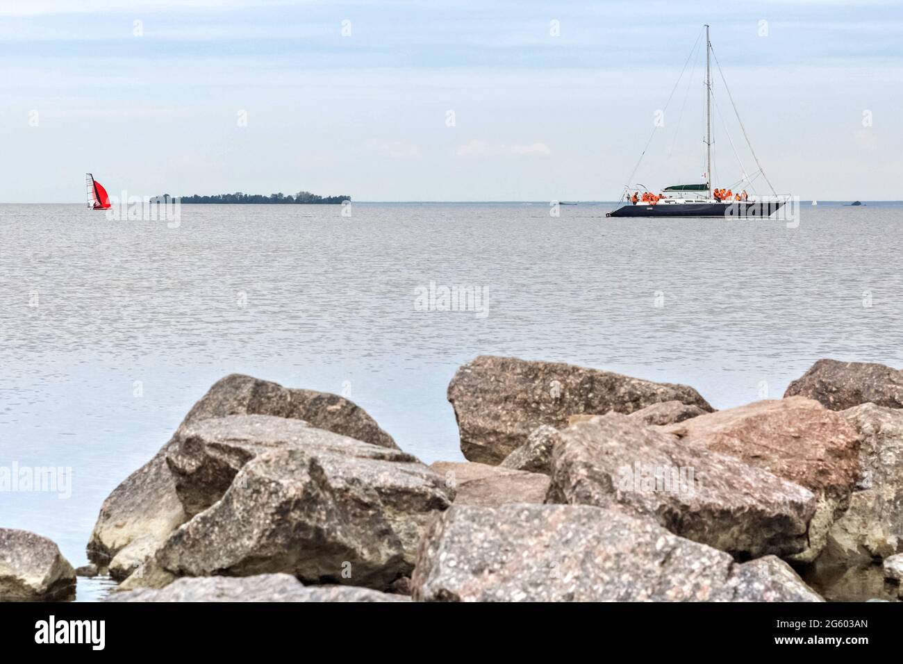 Granite stones in the water on the shore of the Gulf of Finland ...