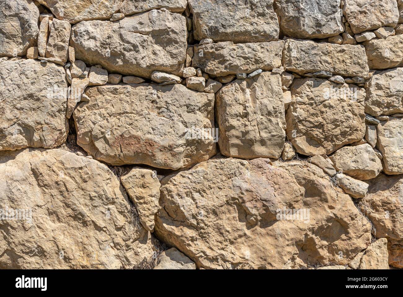 Real antique greek stonewall in sunny day background texture. Detail ...