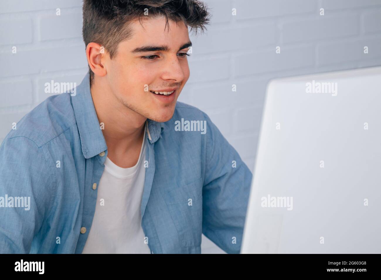 portrait of teenage student in front of computer Stock Photo - Alamy