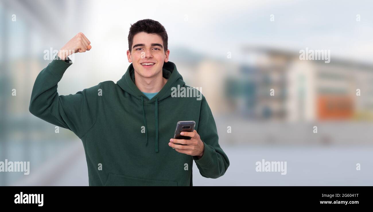 teenage student with cell phone and sign of success Stock Photo - Alamy