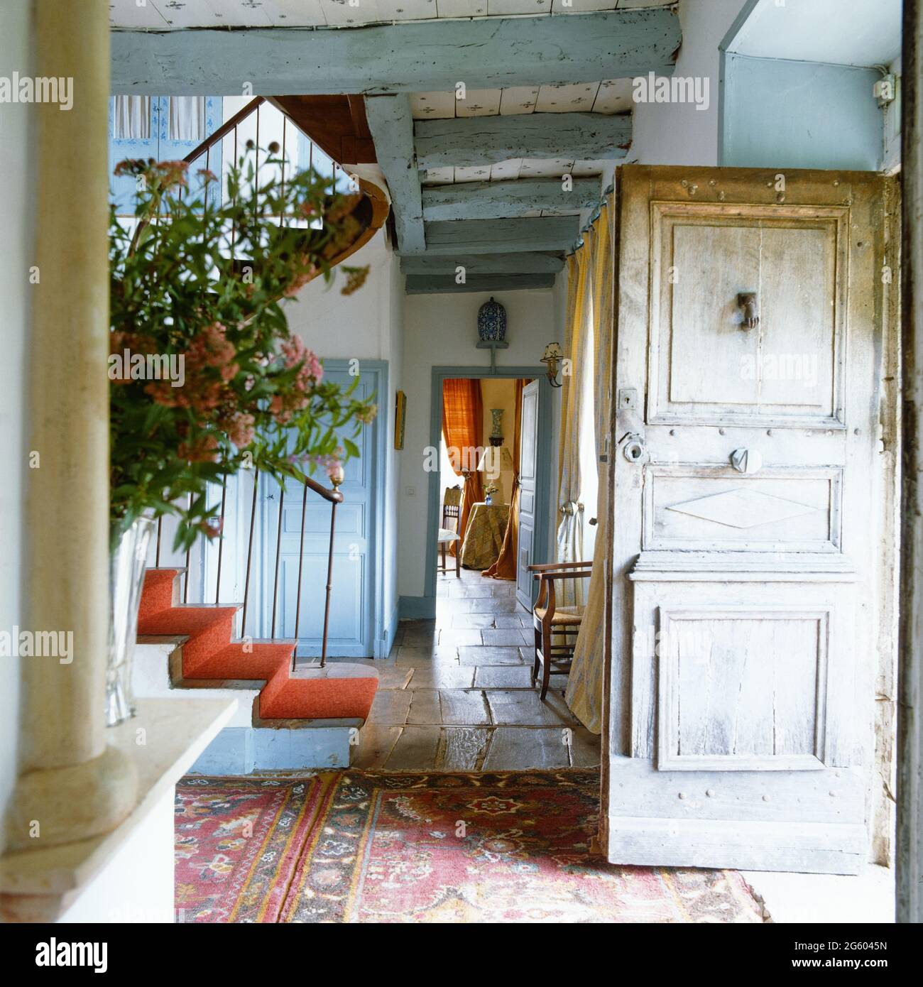 Entrance hall with red door hi-res stock photography and images - Alamy