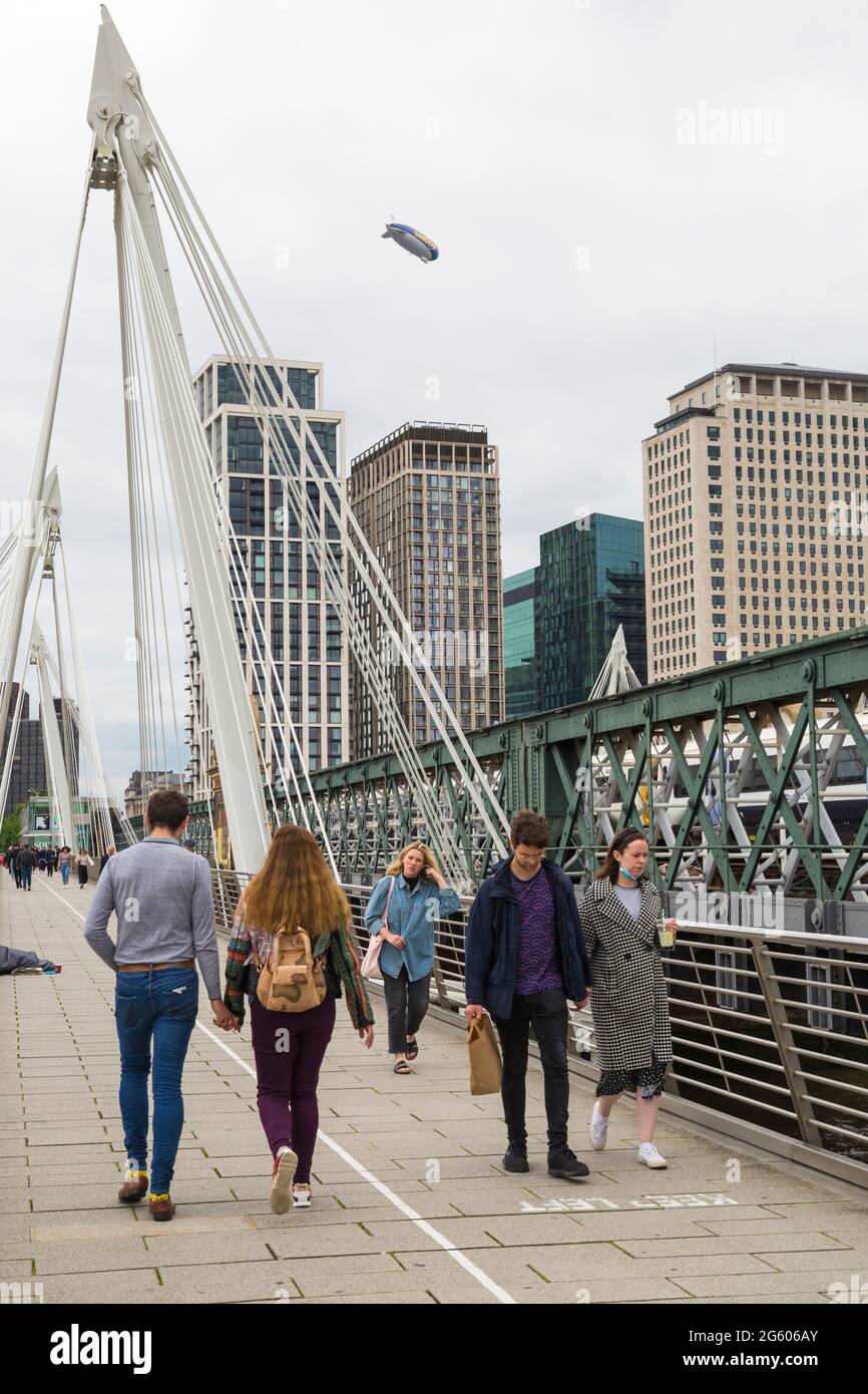 London, UK. 30th June, 2021. The Goodyear Blimp Air Ship flies over the ...
