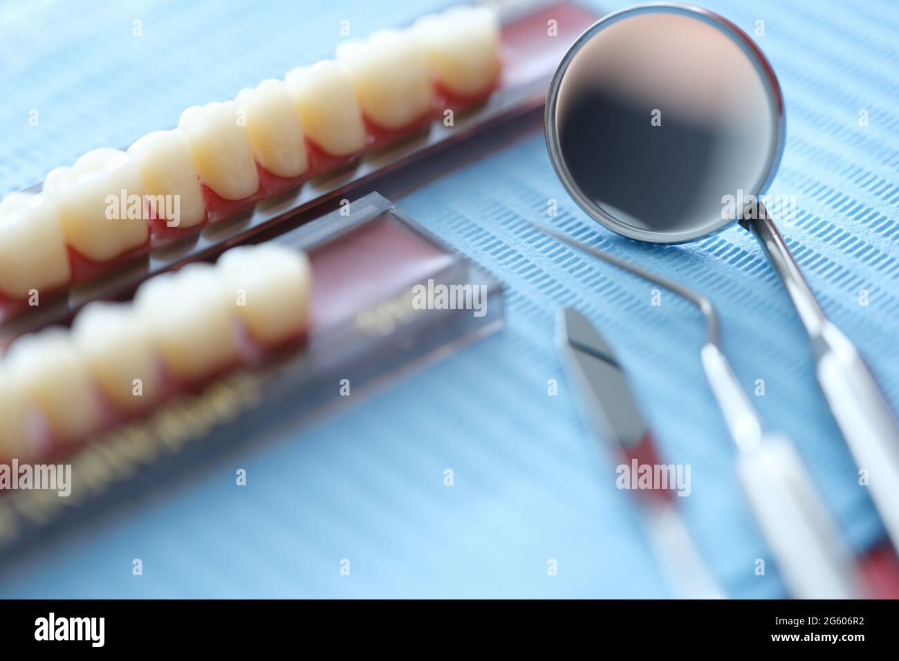 Set of dentures and dental instruments. closeup Stock Photo - Alamy