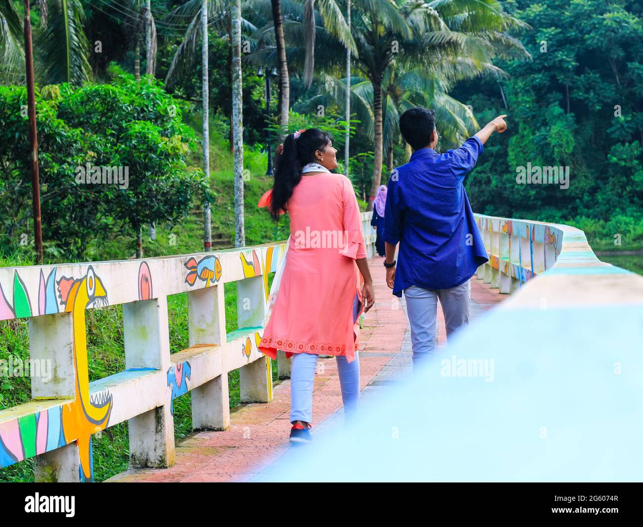 Man walk behind woman hi-res stock photography and images - Alamy