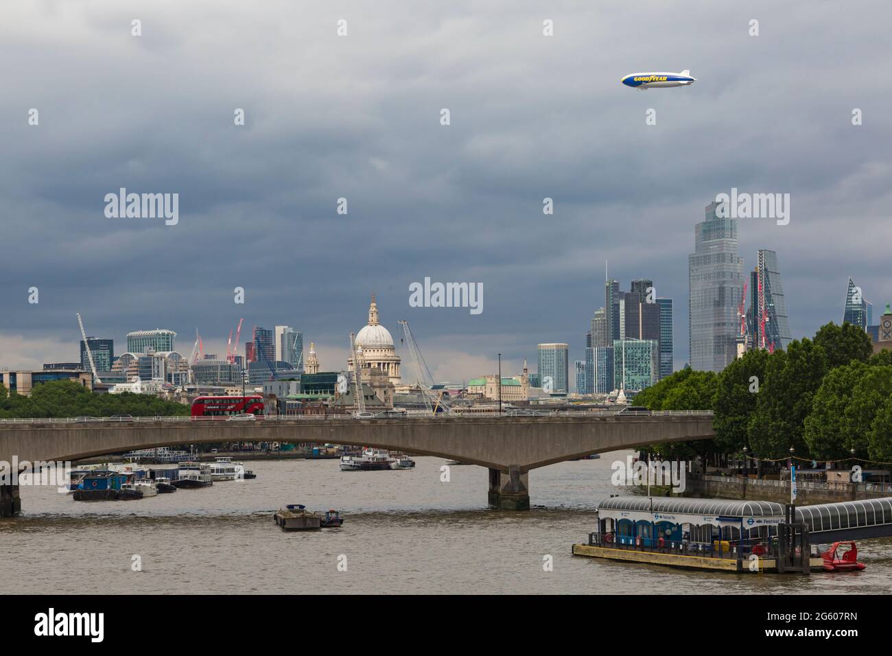 London, UK. 30th June, 2021. The Goodyear Blimp Air Ship flies over the ...