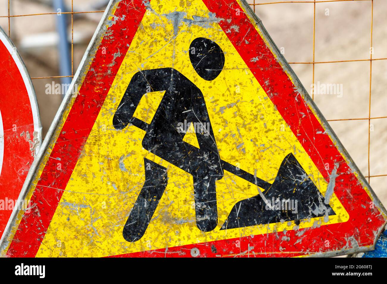 Road sign are going construction work close up. figurine of a man with ...