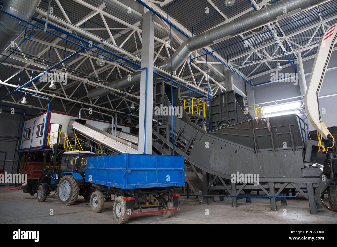 Central conveyor of the waste sorting plant. Recycling and storage of ...