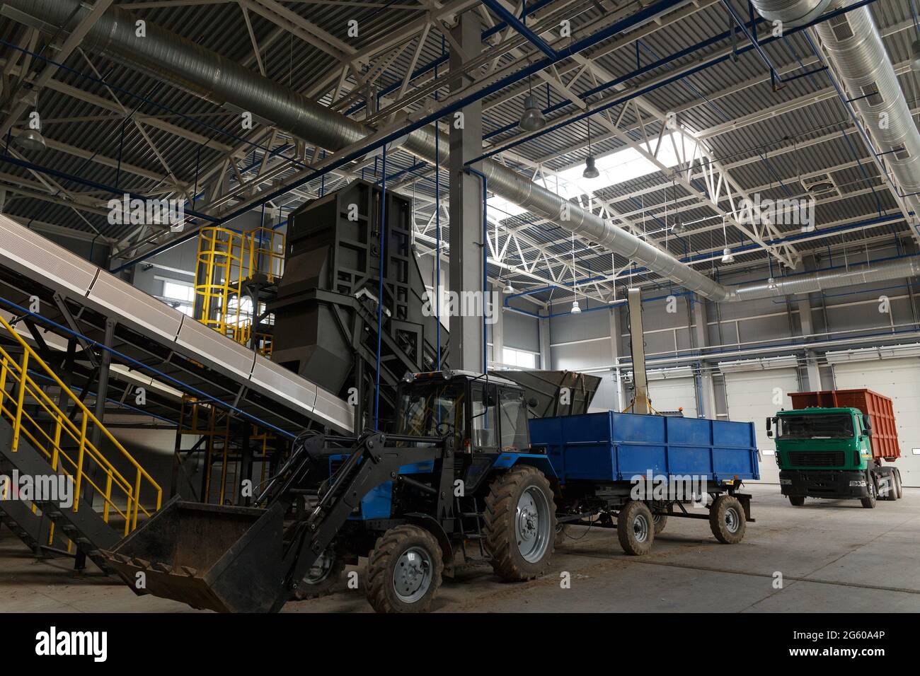 Central conveyor of the waste sorting plant. Recycling and storage of ...