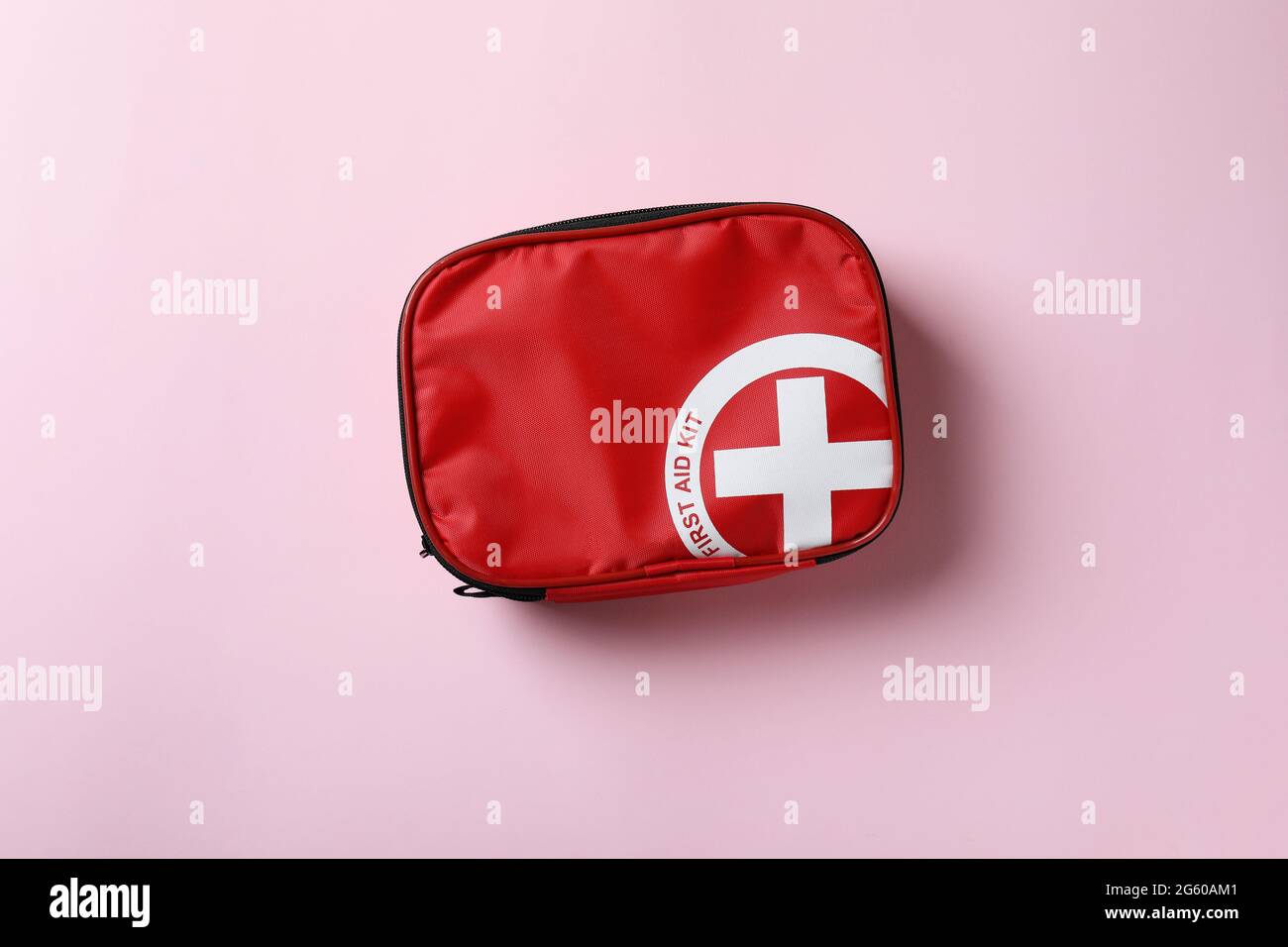 First aid medical kit on pink background Stock Photo - Alamy