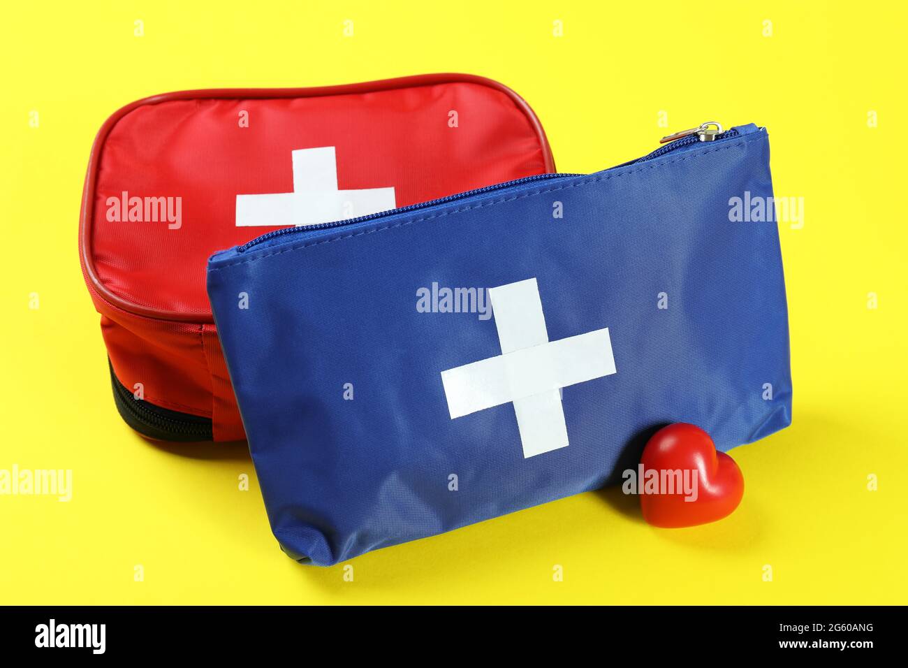 First aid medical kits on yellow background Stock Photo - Alamy