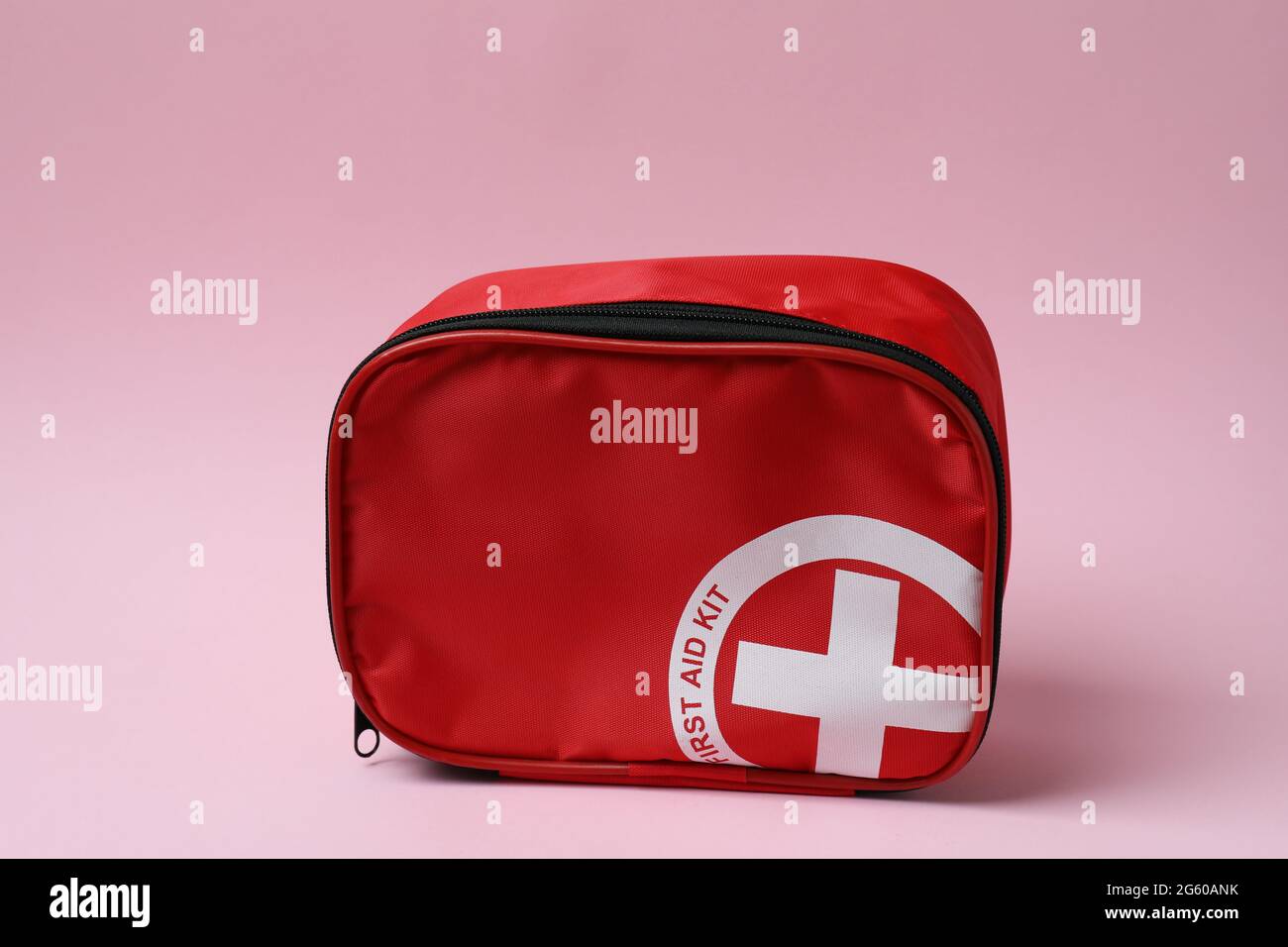 First aid medical kit on pink background Stock Photo - Alamy