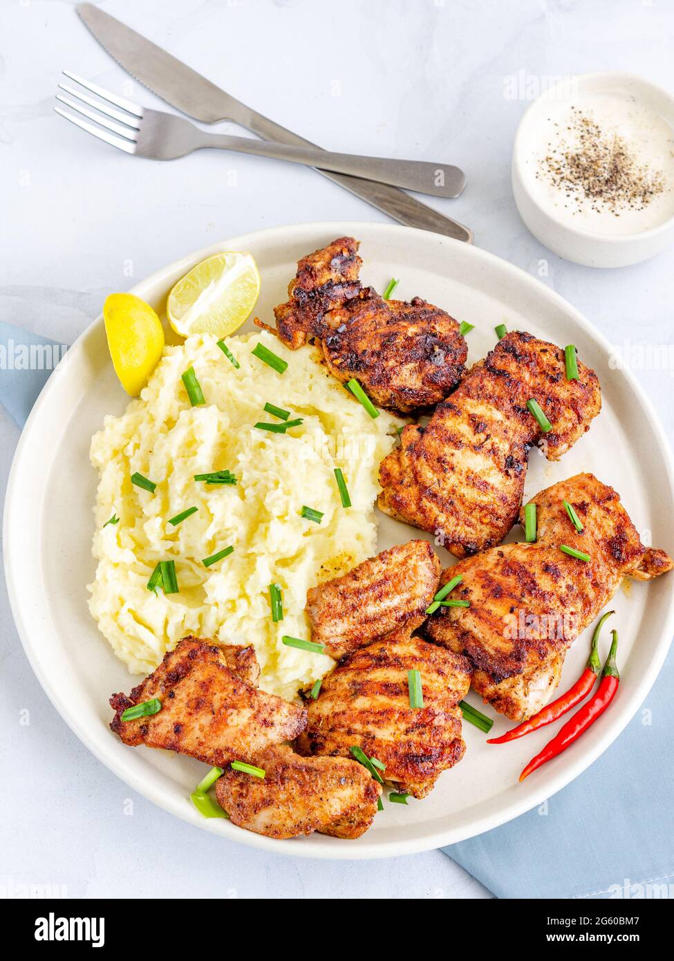 Potato Grilled Chicken Thighs with Mashed Potatoes Garnished with Chive ...