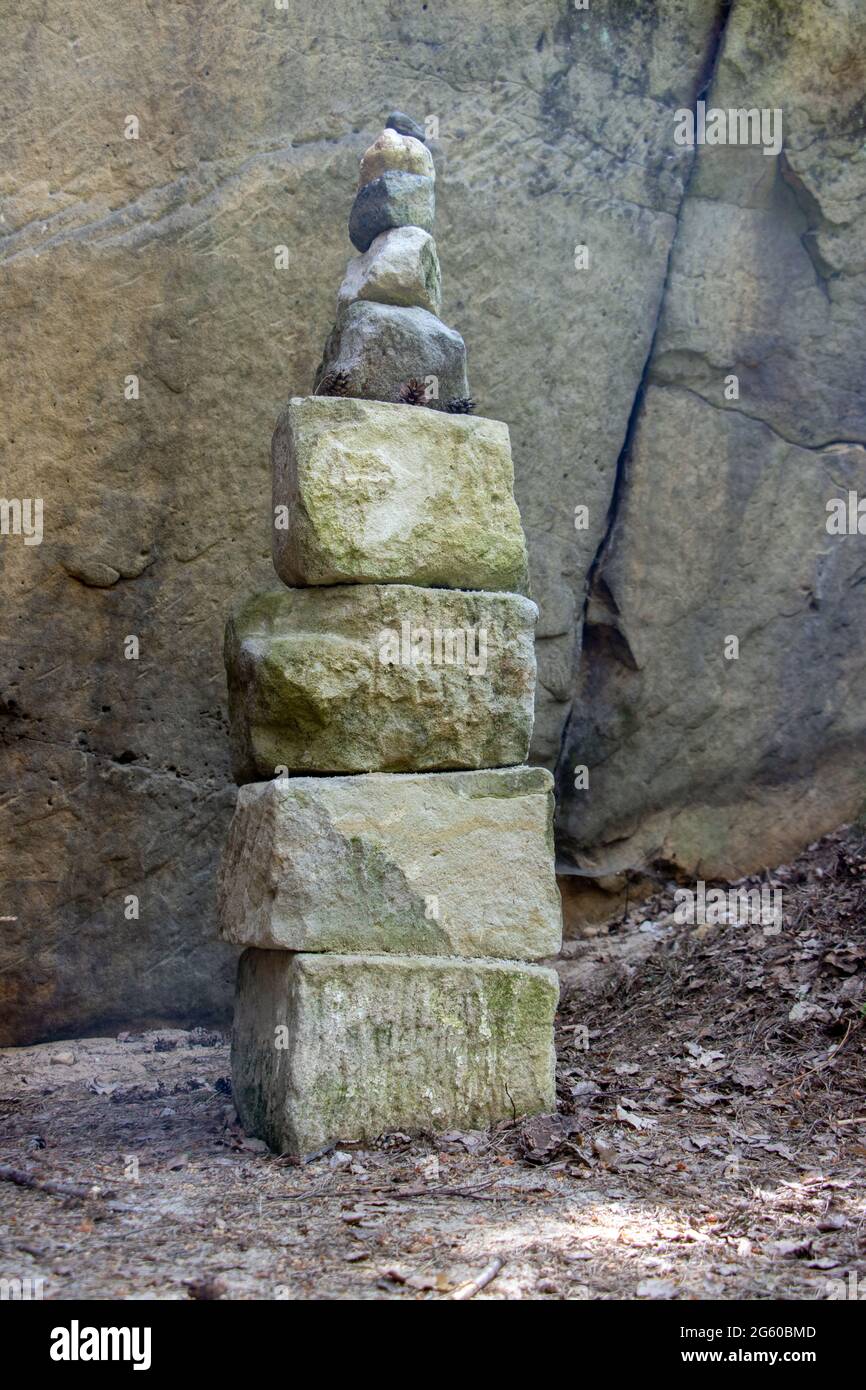 Stones arranged in a tower in nature with rocks Stock Photo - Alamy