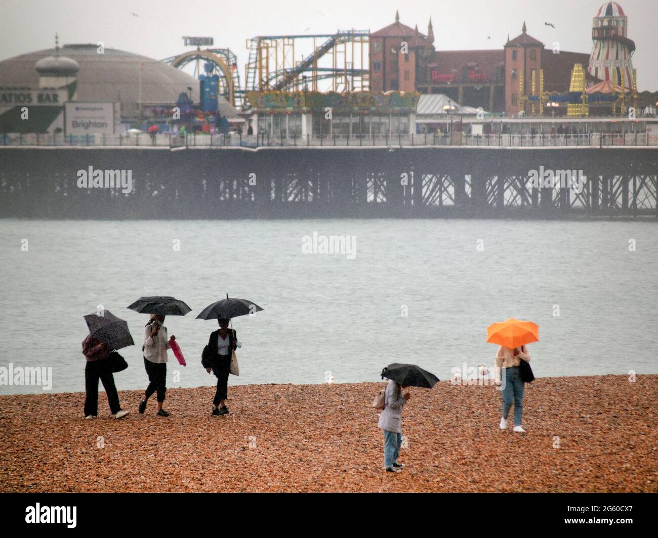 A wet day on the beach at Brighton Stock Photo - Alamy