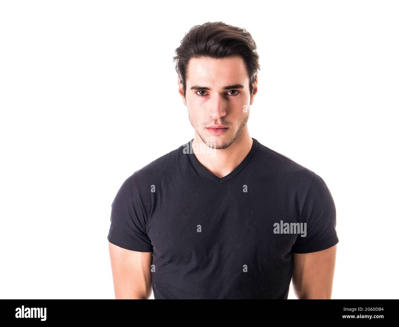 Handsome young man looking at camera in studio Stock Photo - Alamy