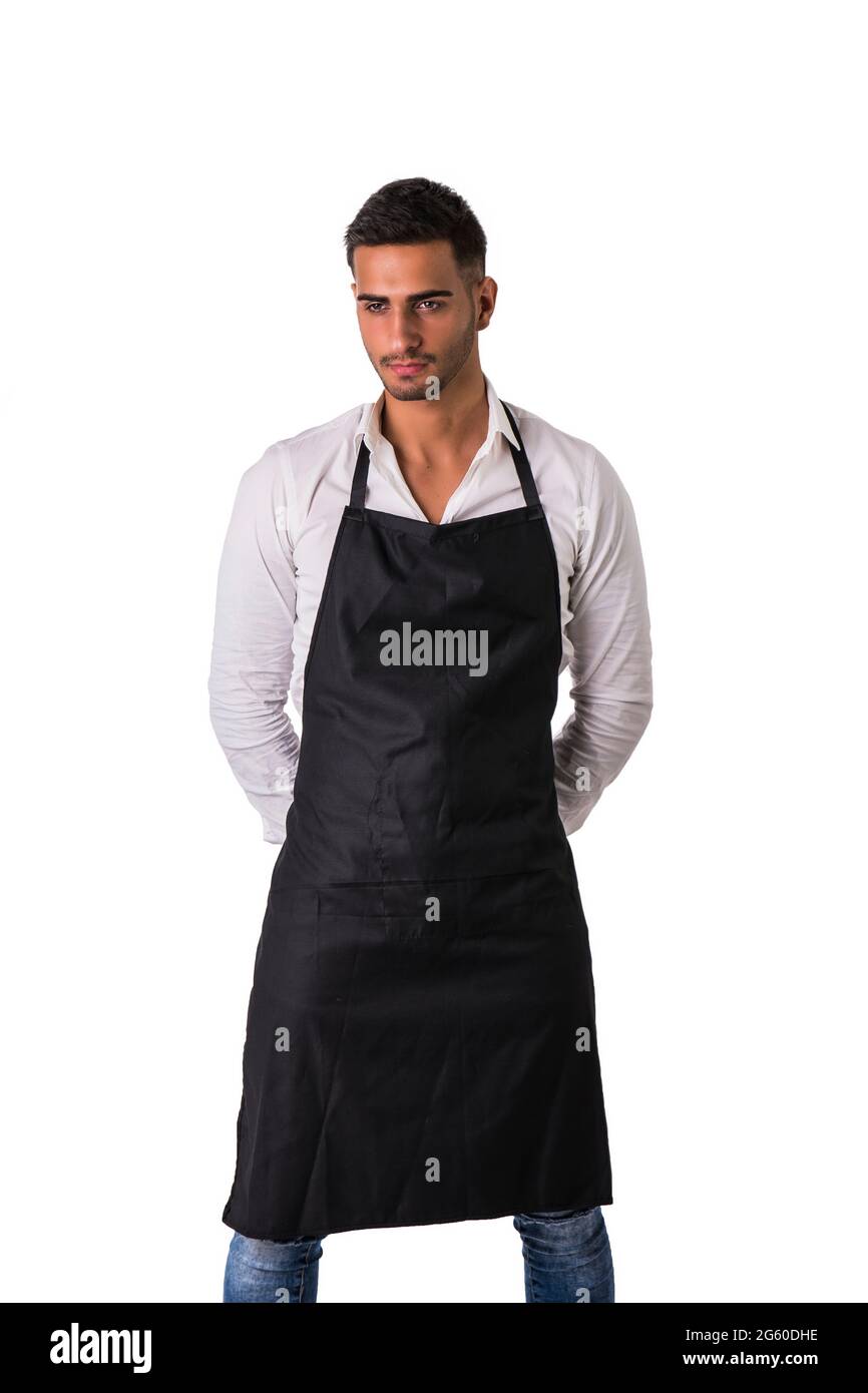 Young chef or waiter wearing black apron Stock Photo - Alamy