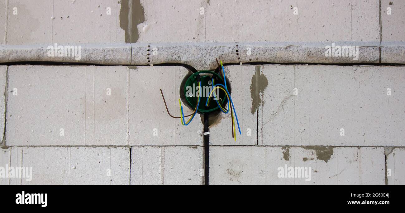 electrical wiring of the house, cable on the wall in the gate ...