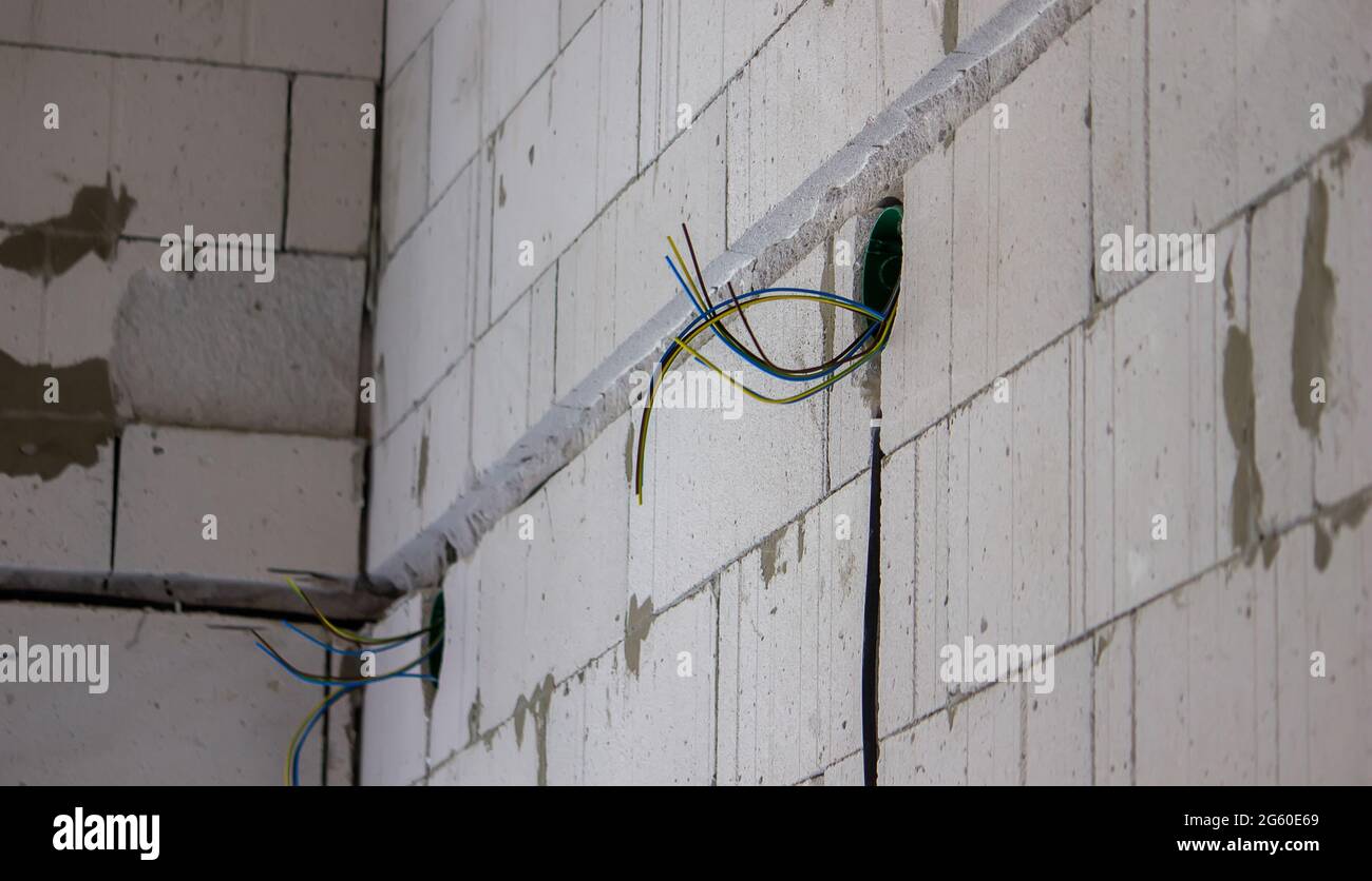 electrical wiring of the house, cable on the wall in the gate ...