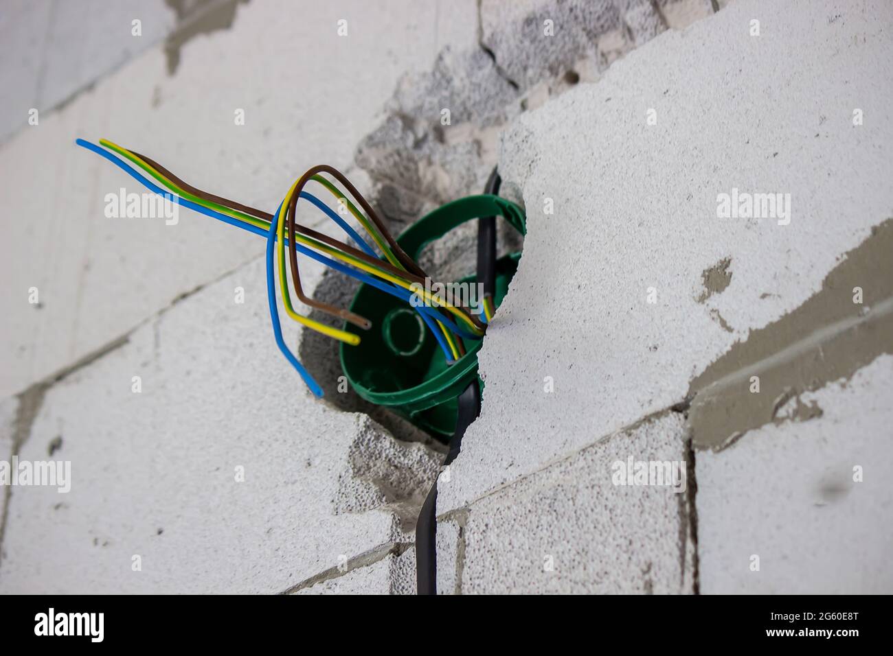 electrical wiring of the house, cable on the wall in the gate ...