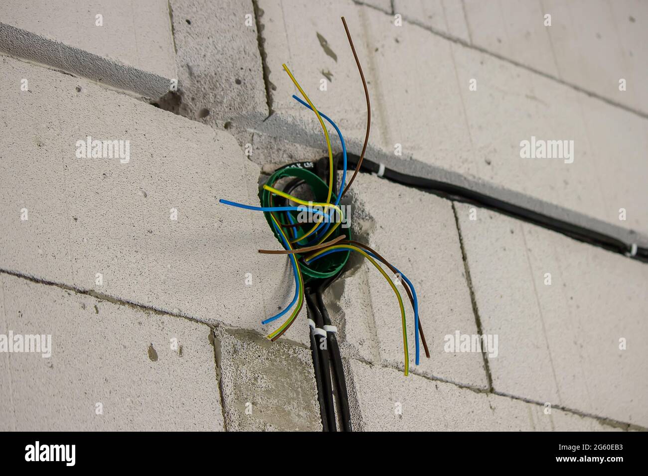 electrical wiring of the house, cable on the wall in the gate ...