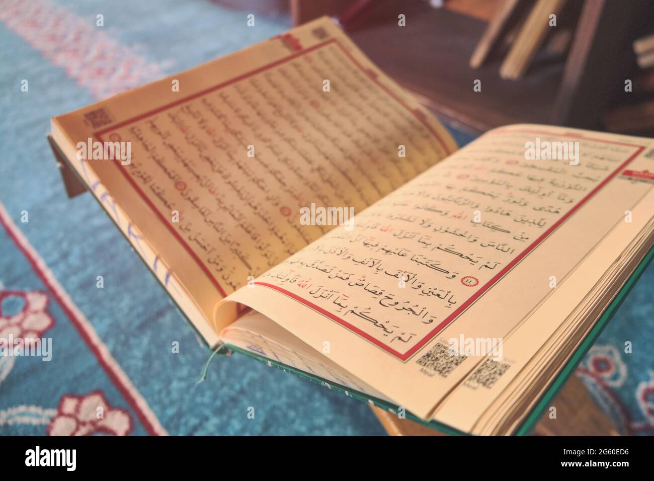Open holy quran on wood stand hi-res stock photography and images - Alamy