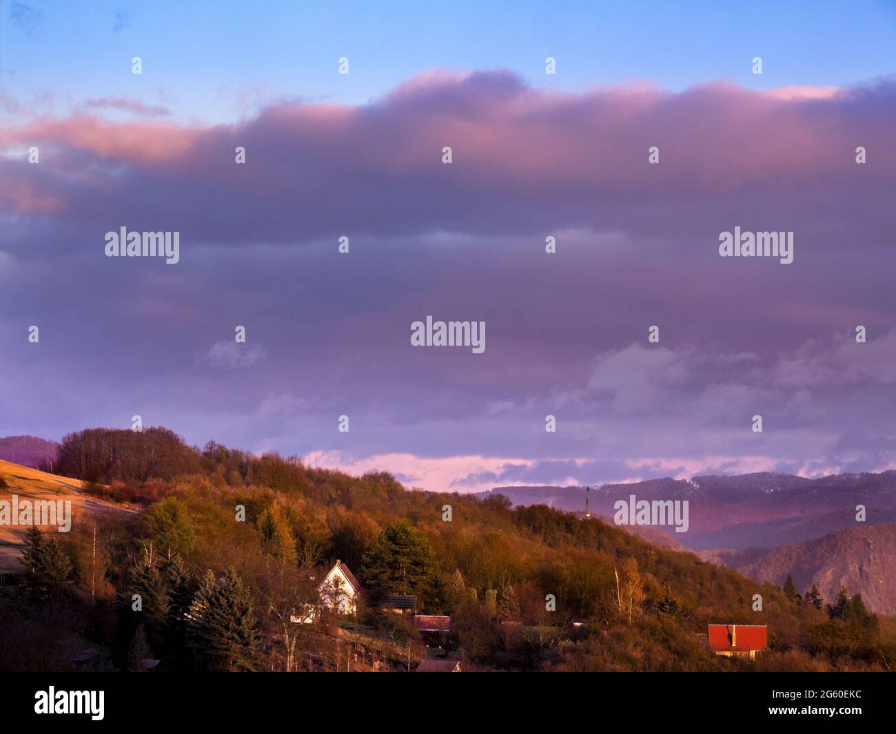 Hilly landscape with snow-capped hills in the distance on the horizon ...