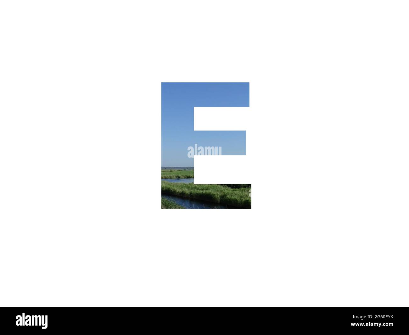 letter E of the alphabet made with landscape with grass, stream and a ...
