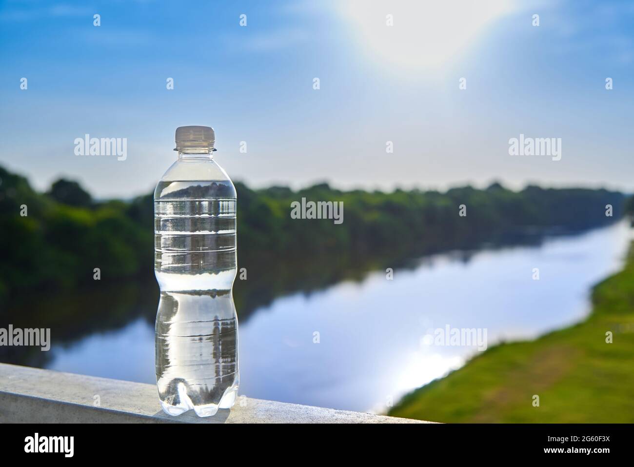 Pure transparent drinking water in a plastic bottle against the ...