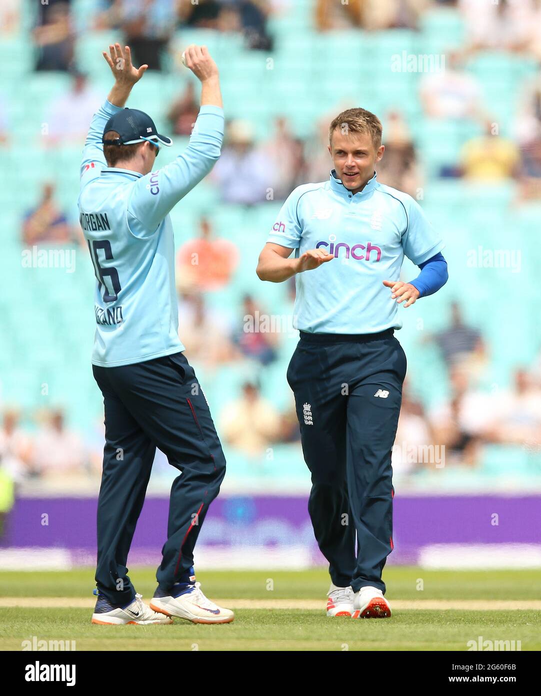 England's Sam Curran (right) celebrates with team-mate Eoin Morgan ...
