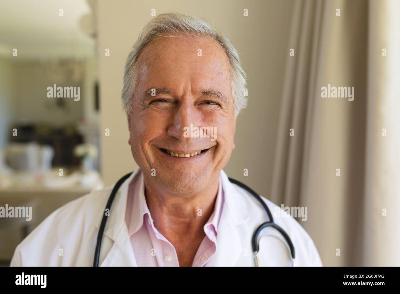 Smiling doctor looking camera patient hi-res stock photography and ...