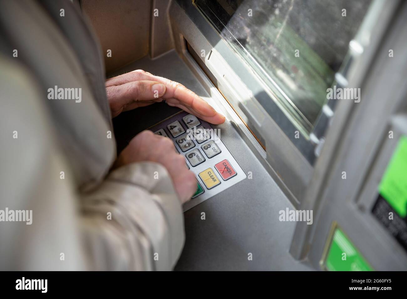 A close-up over the shoulder shot of an unrecognisable caucasian woman ...