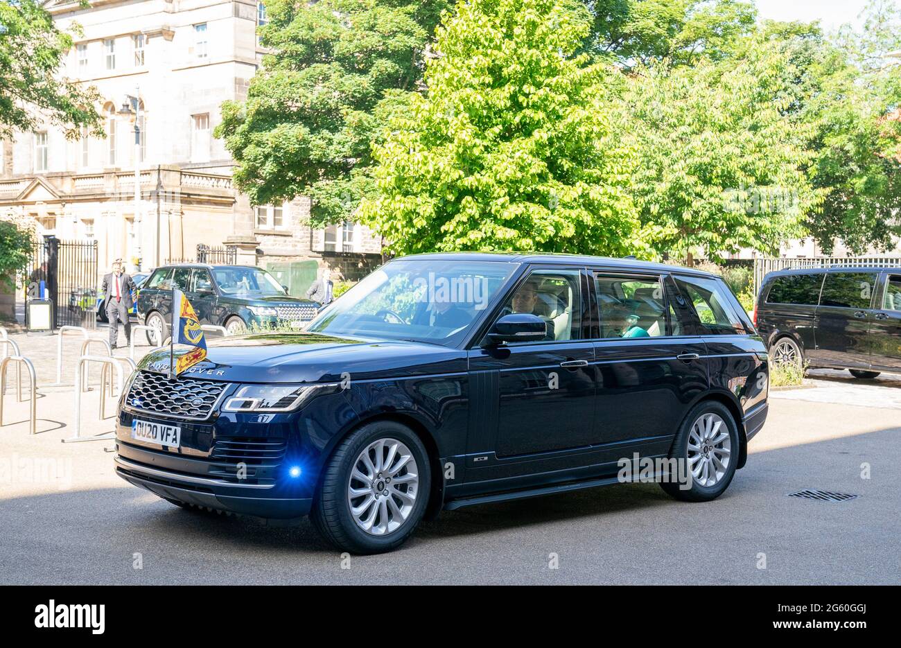 Queen Elizabeth II arrives in a hybrid-electric Land Rover for a visit ...