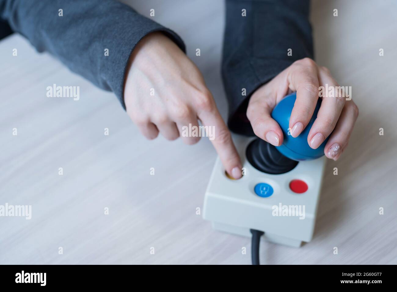 Woman with cerebral palsy works on a specialized computer mouse Stock ...