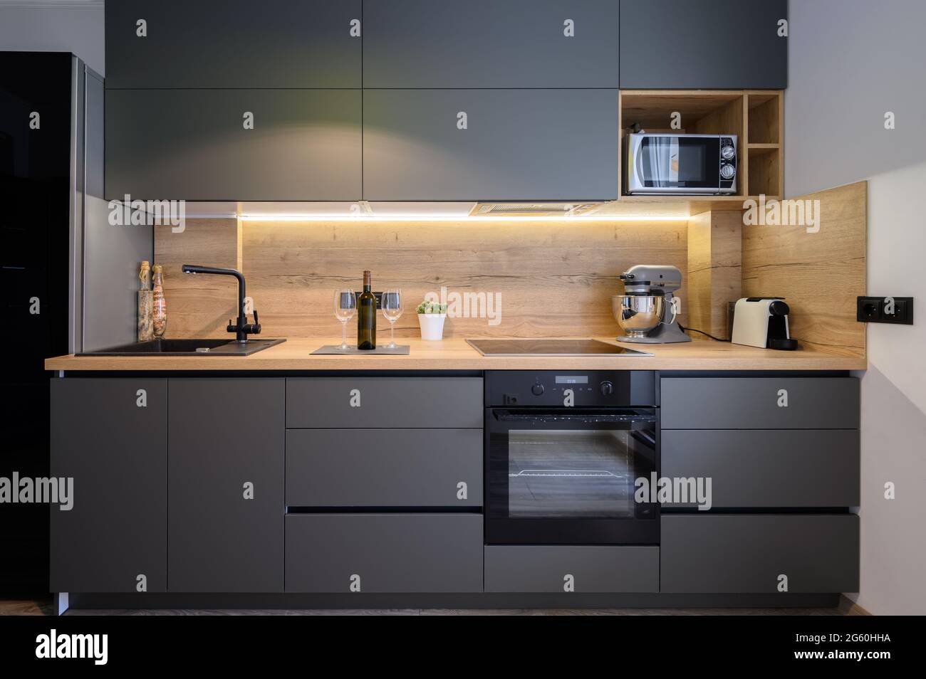 Modern luxury dark gray kitchen Stock Photo - Alamy