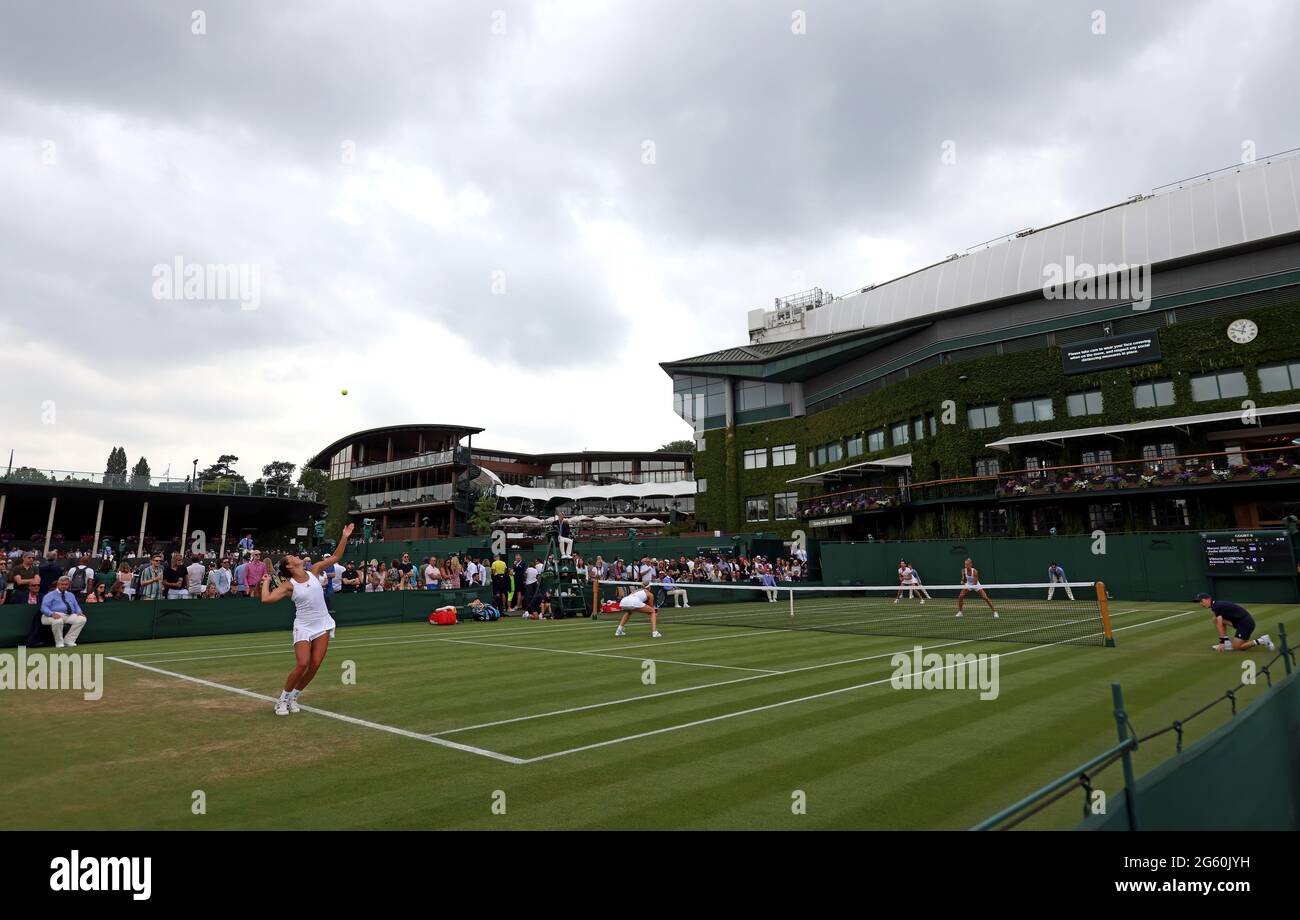Jodie Burrage serves with Naomi Broady against Viktoria Kuzmova and ...