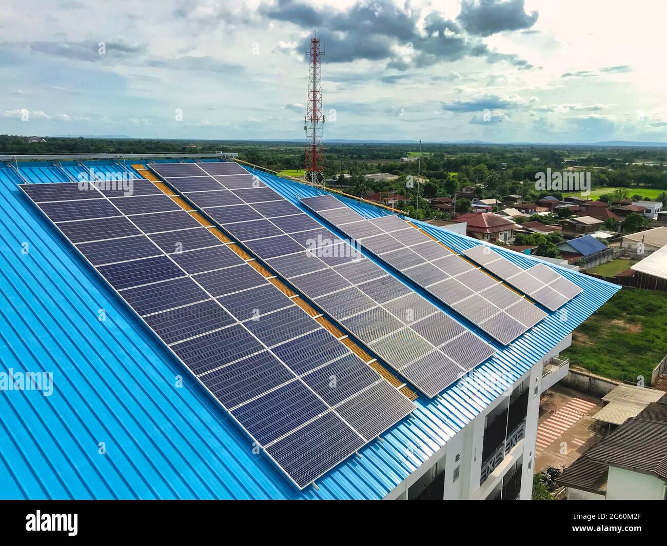 Photovoltaic power plant on the roof of a residential building on sunny ...